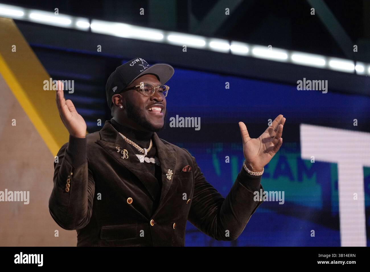 Alabama offensive lineman Tyler Booker celebrates after being chosen by ...