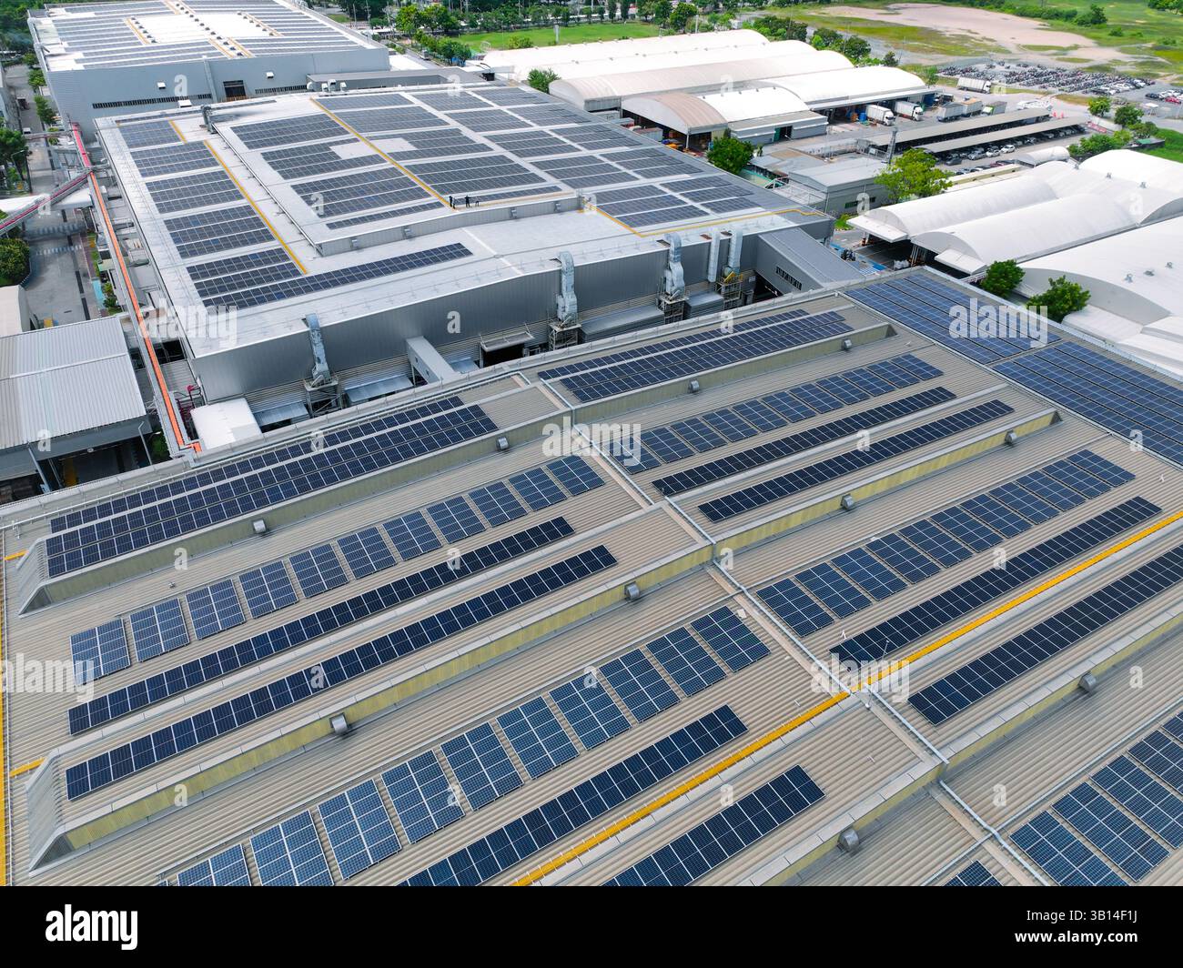 Solar-powered warehouse facility. Modern distribution center with ...