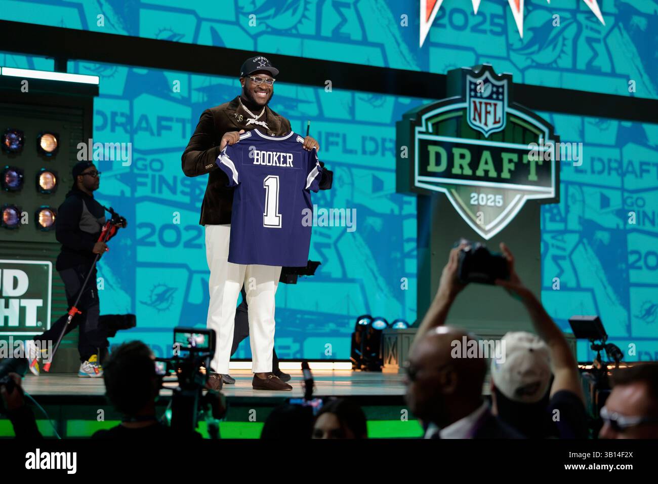 Alabama offensive lineman Tyler Booker poses after being chosen by the ...