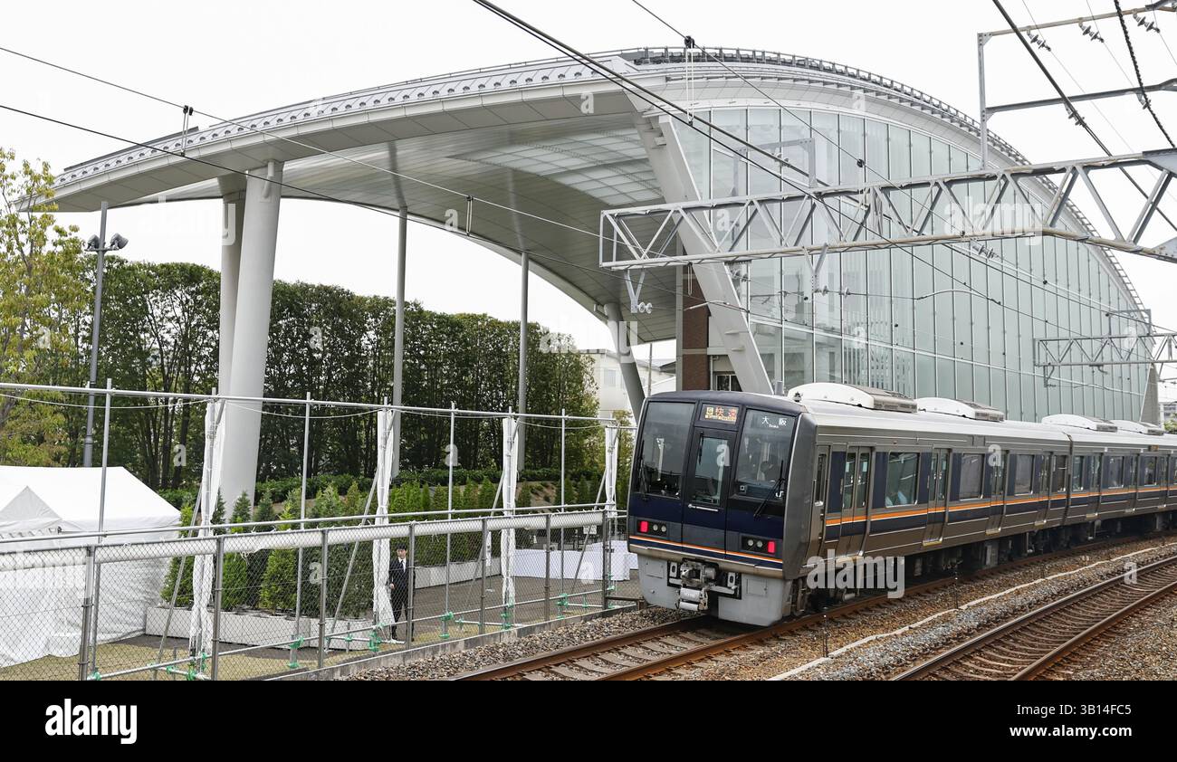 A train passes near the site of the 2005 fatal train derailment in the western Japan city of ...