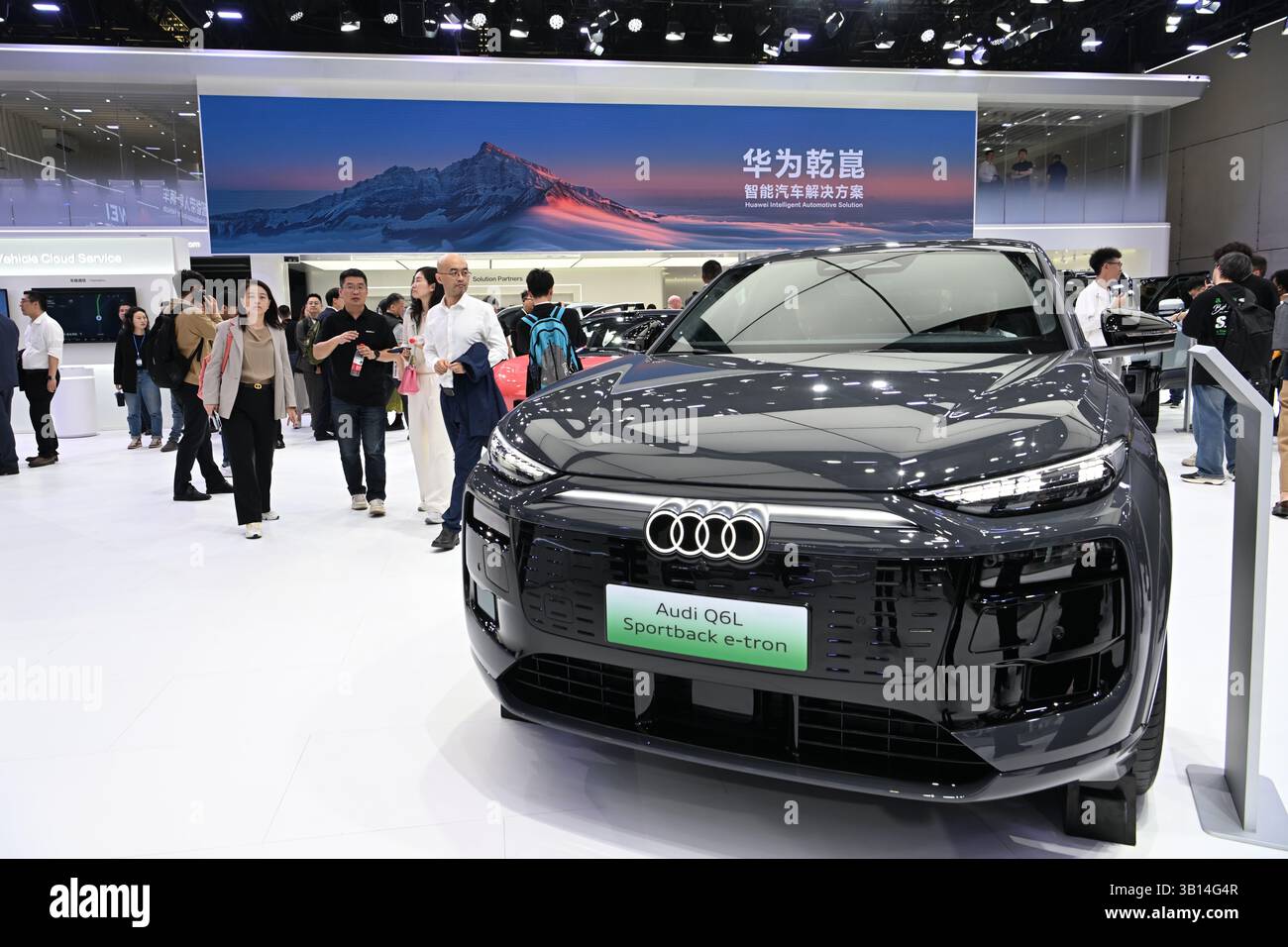Visitors visited a smart car displayed at HUAWEI's exhibition area at ...