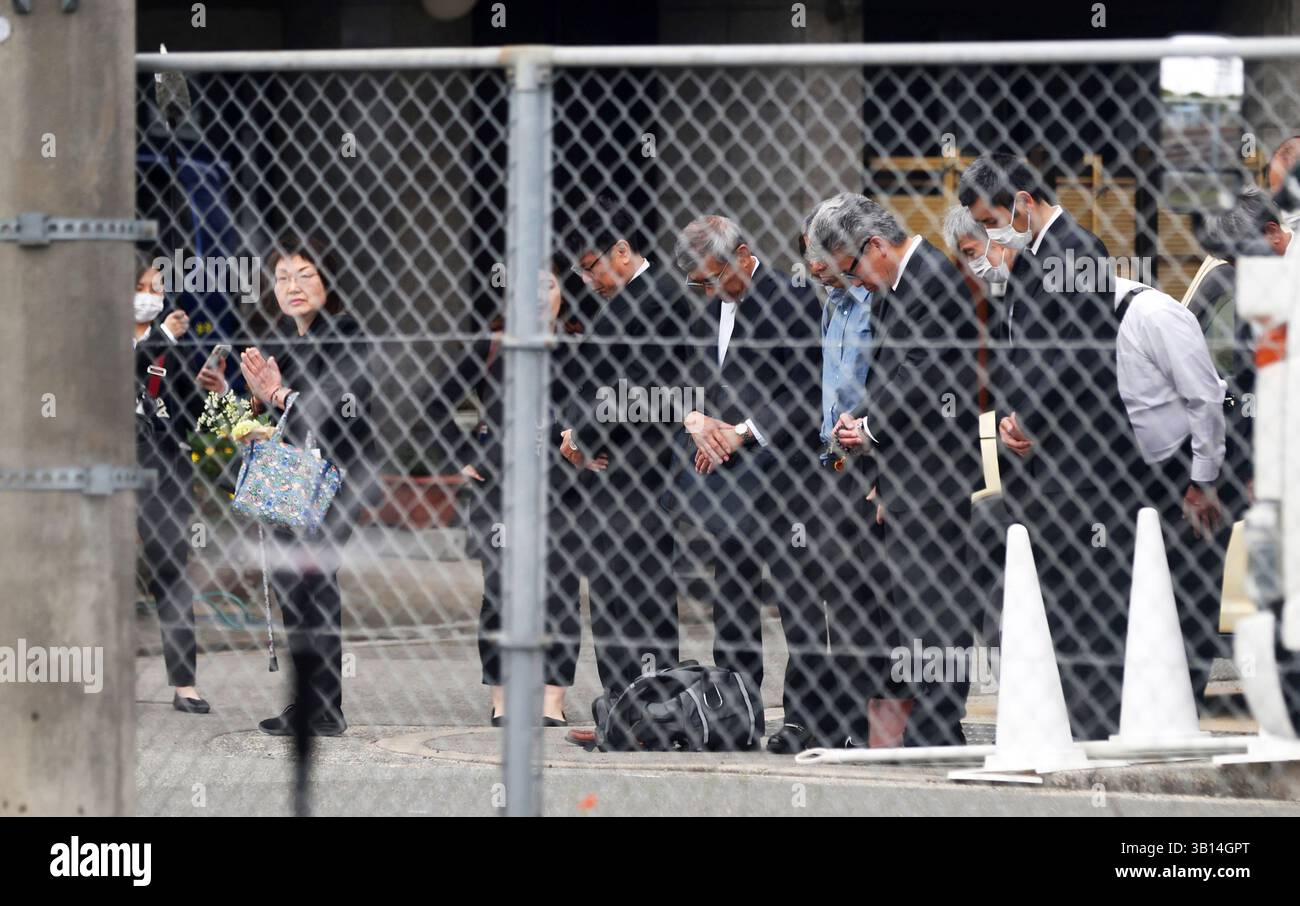 People pray for the victims of a train derailment accident 20 years ago in Amagasaki City, Hyogo ...