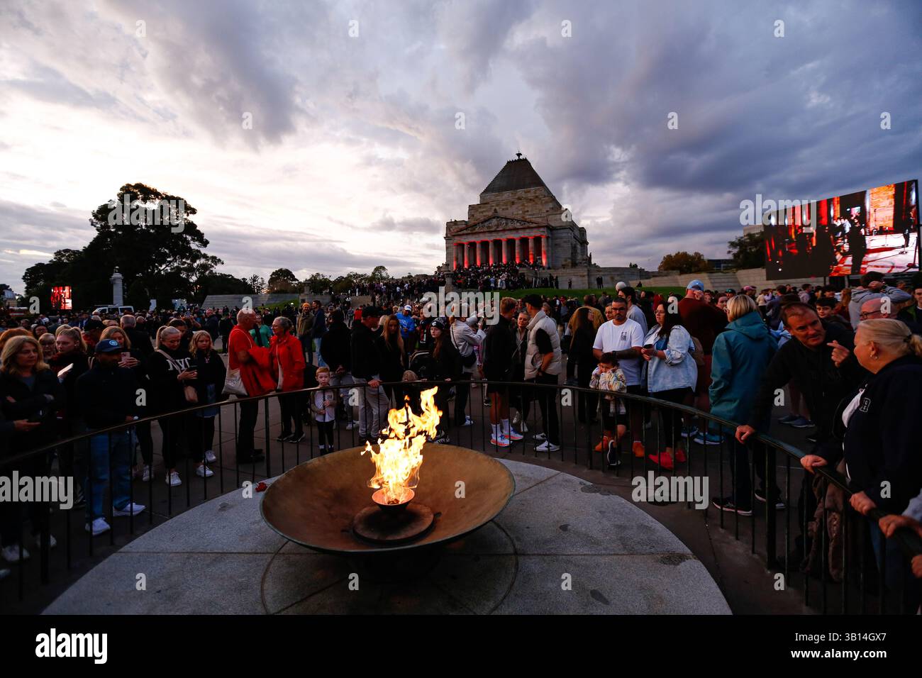 People pay their respects at the eternal flame during the ANZAC ...