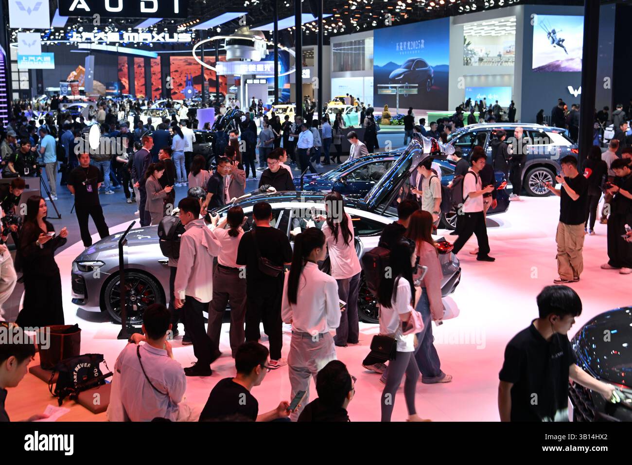 Visitors visited a model displayed at the Audi booth at the 2025 ...