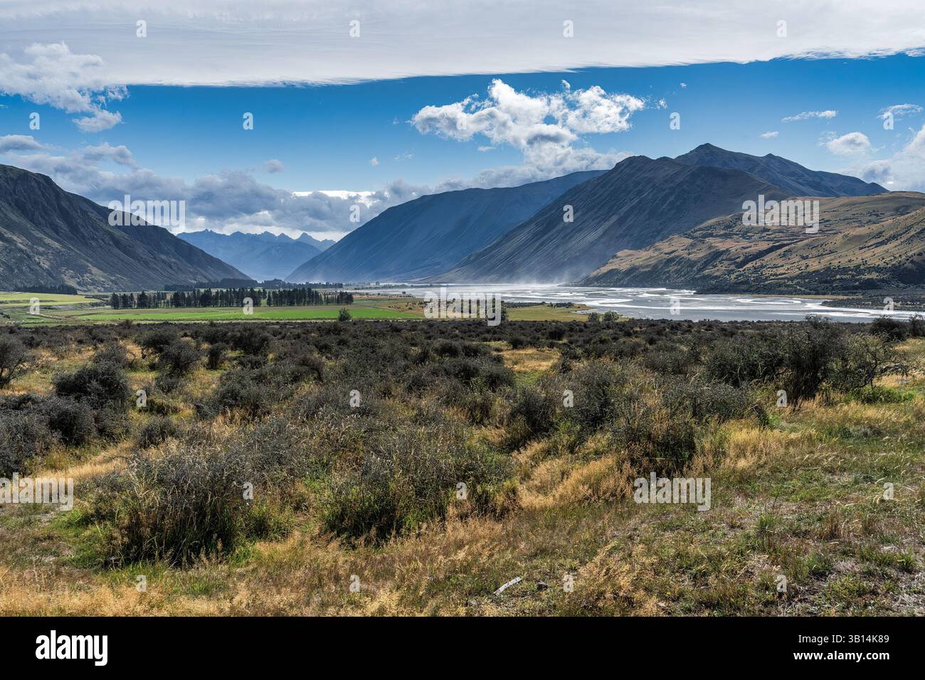 Surrounded by mountain ranges the extreme arid dry farming fields in ...