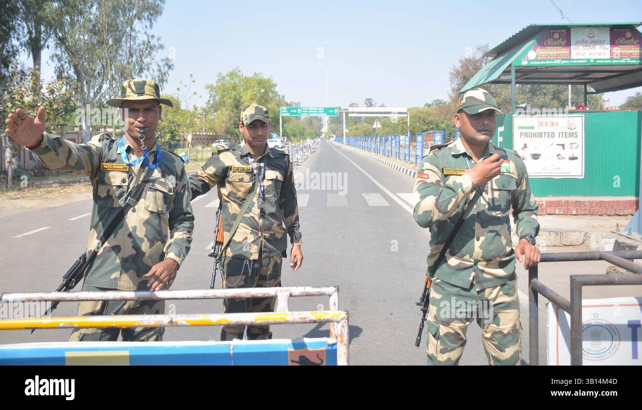 AMRITSAR, INDIA - APRIL 24: Border Security Force personnel stand guard ...