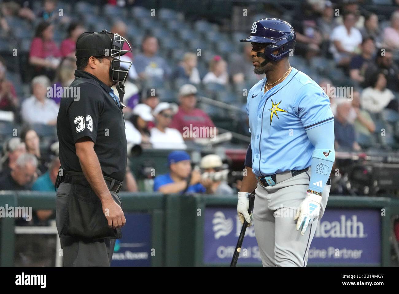 Tampa Bay Rays first base Yandy Díaz (2) talks to home plate umpire ...