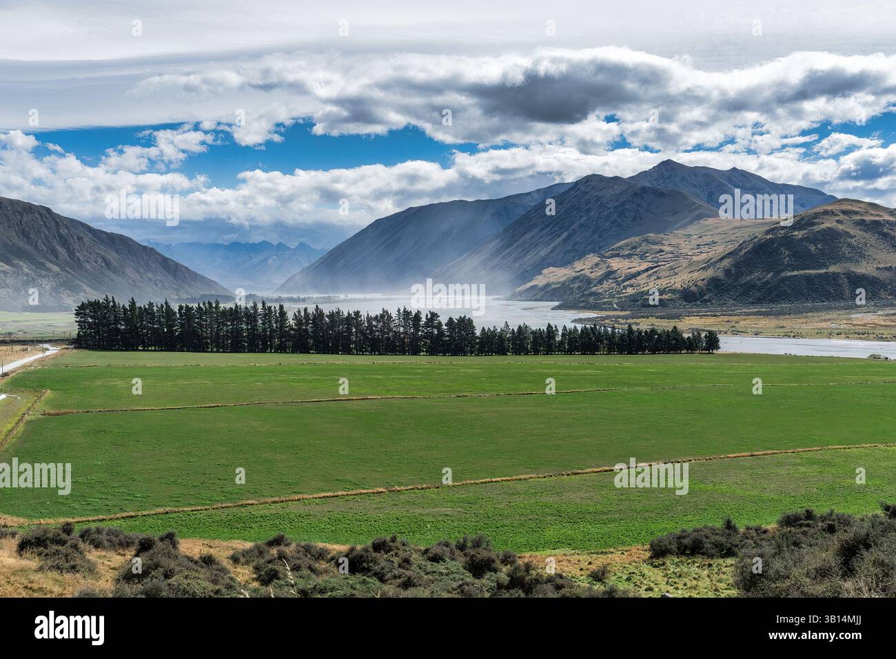 Surrounded by mountain ranges the extreme arid dry farming fields in ...