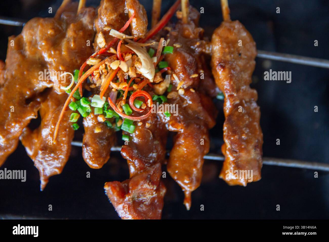 Indonesian Satay being served on a mini grill Stock Photo - Alamy