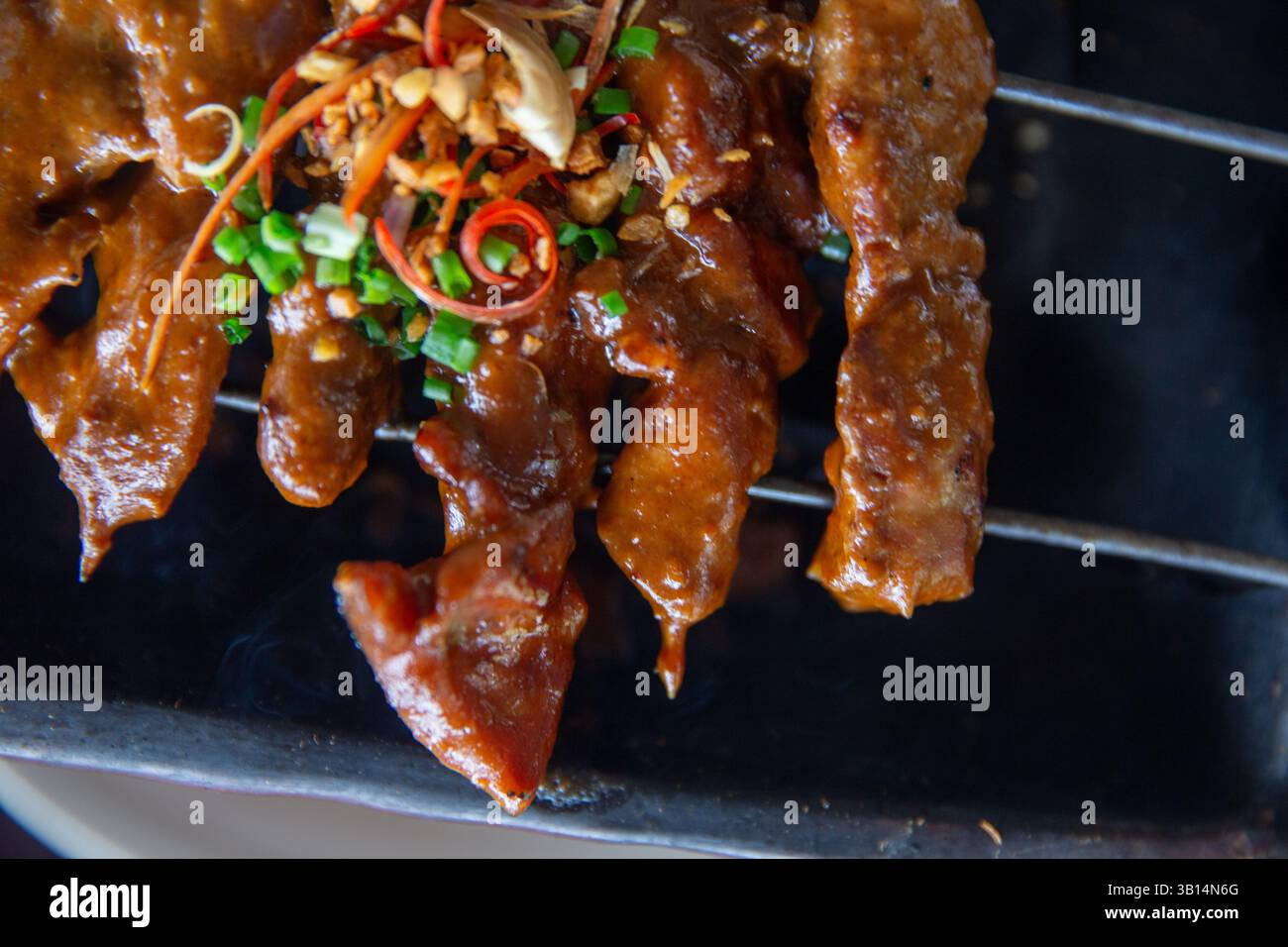 Indonesian Satay being served on a mini grill Stock Photo - Alamy