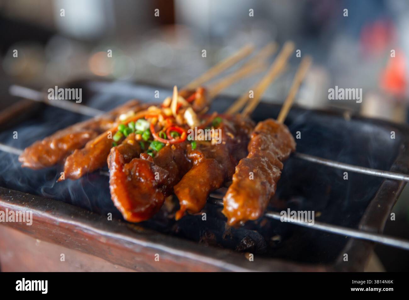 Indonesian Satay being served on a mini grill Stock Photo - Alamy
