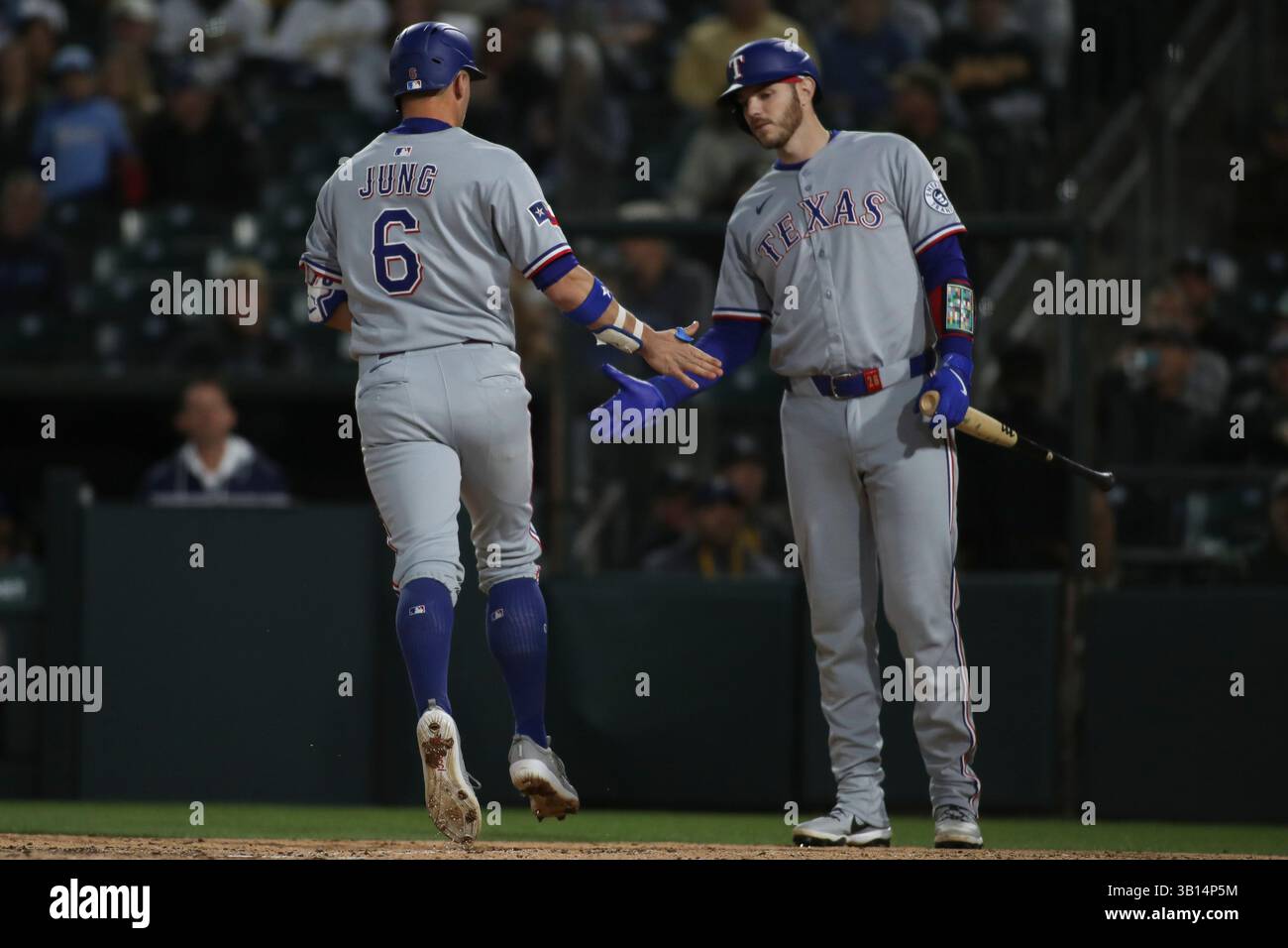 Texas Rangers Josh Jung (6) and Jonah Heim, right, high five after Jung ...