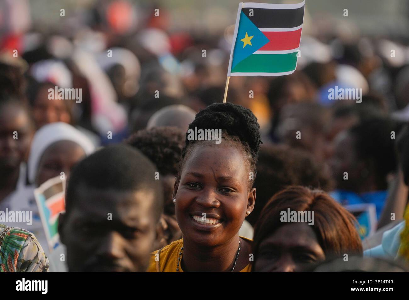 FILE - People wait for Pope Francis to arrive to give a Mass at John ...