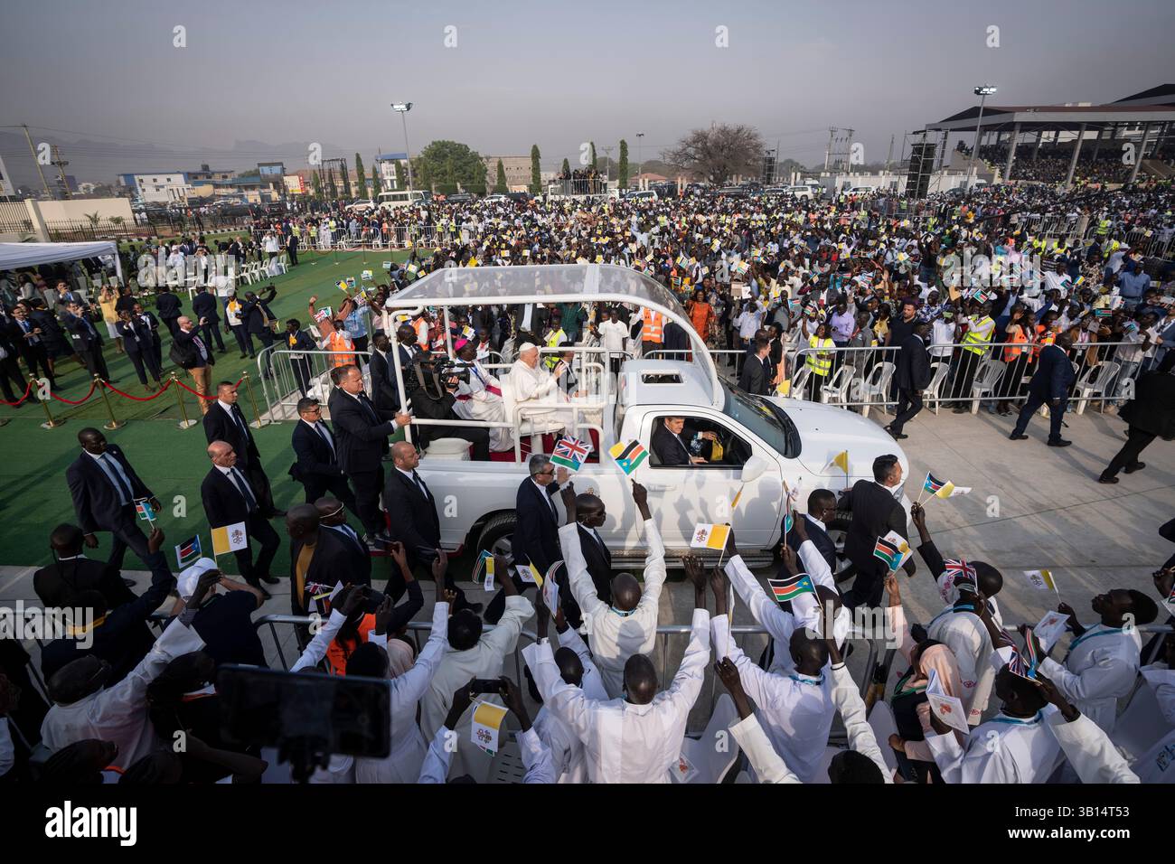FILE - Pope Francis waves from his popemobile before giving a Holy Mass ...