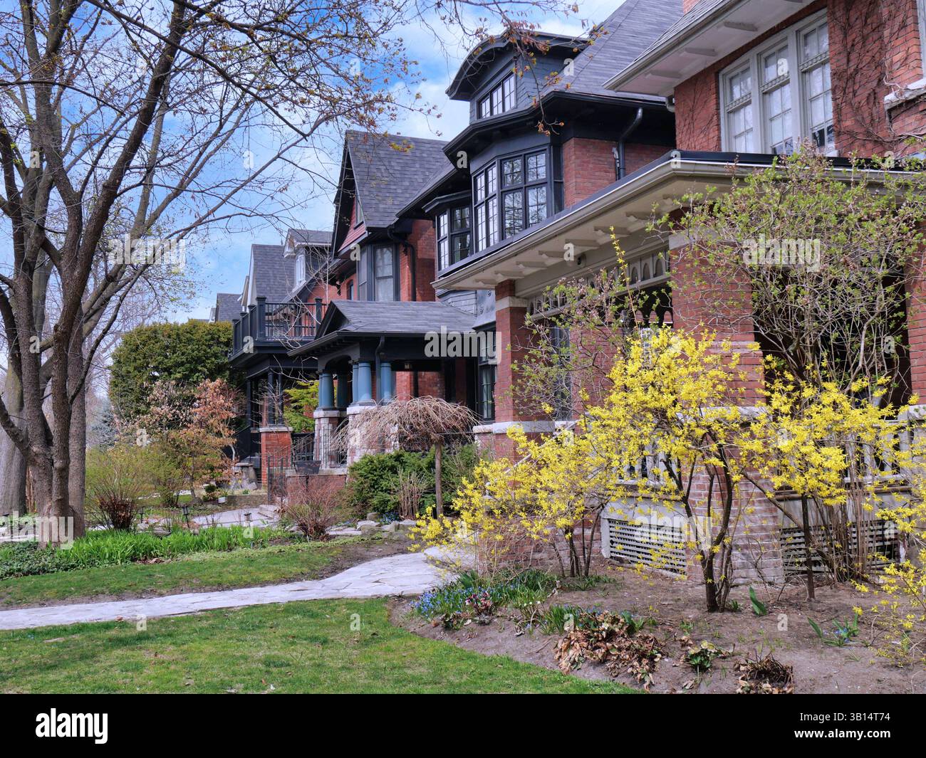 Residential neighborhood with large old detached houses in spring Stock ...