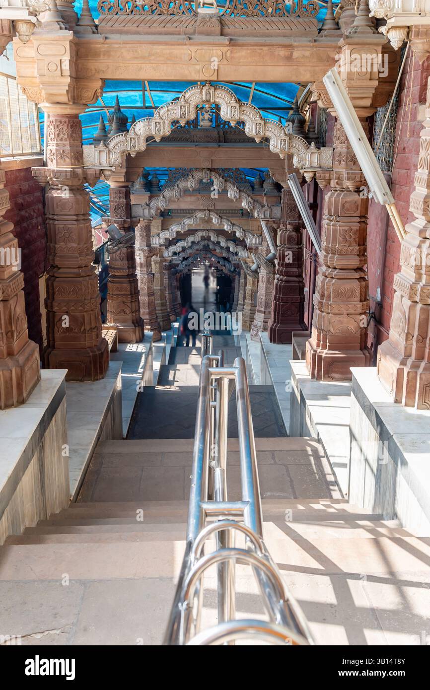 historic hindu temple entrance with intricate carvings in daylight ...