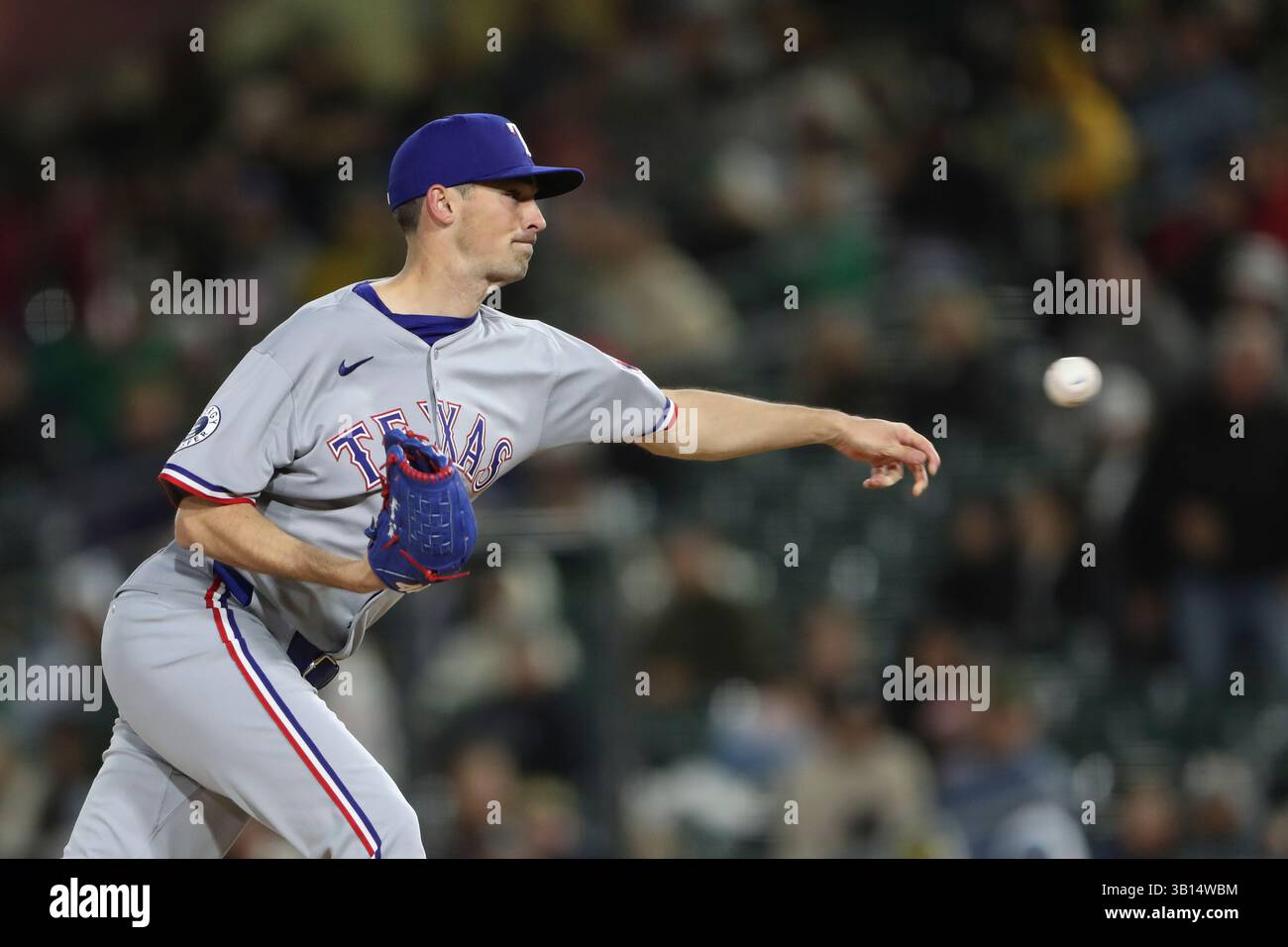 Texas Rangers pitcher Hoby Milner throws a pitch to an Athletics batter ...