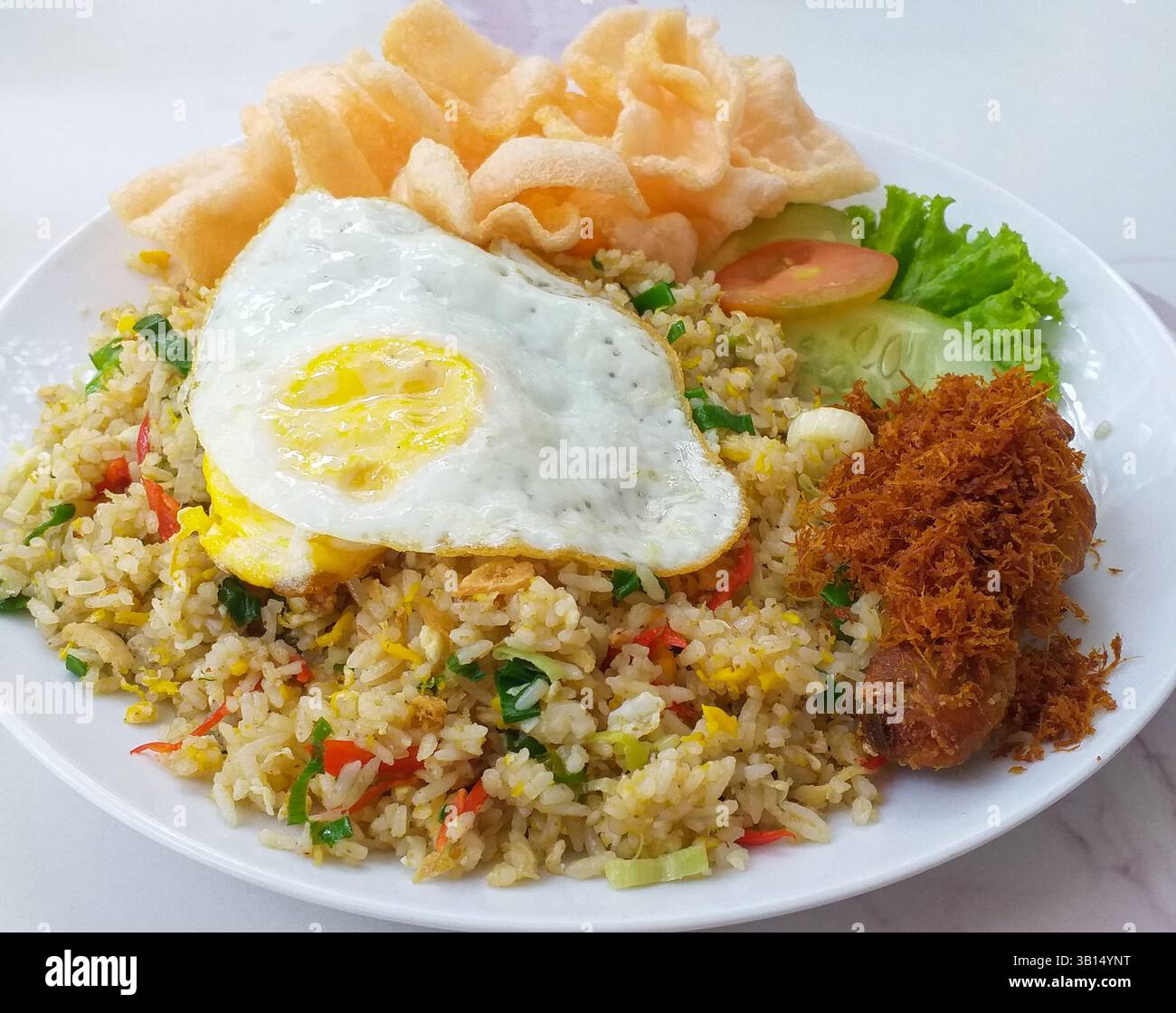 Nasi Goreng with Ayam Goreng or Indonesian Fried Rice with Fried ...