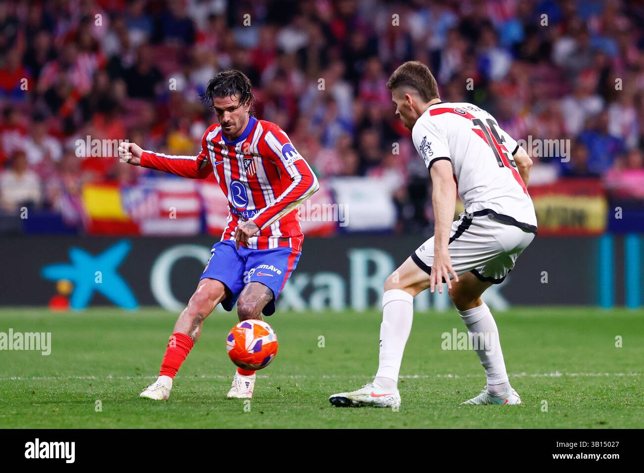Rodrigo De Paul of Atletico de Madrid and Gerard Gumbau of Rayo ...