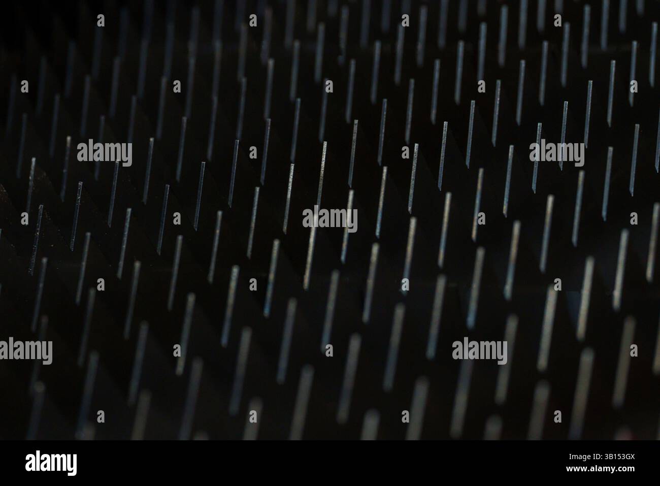 a macro sharp metal teeth, total black background, closeup steel metal ...