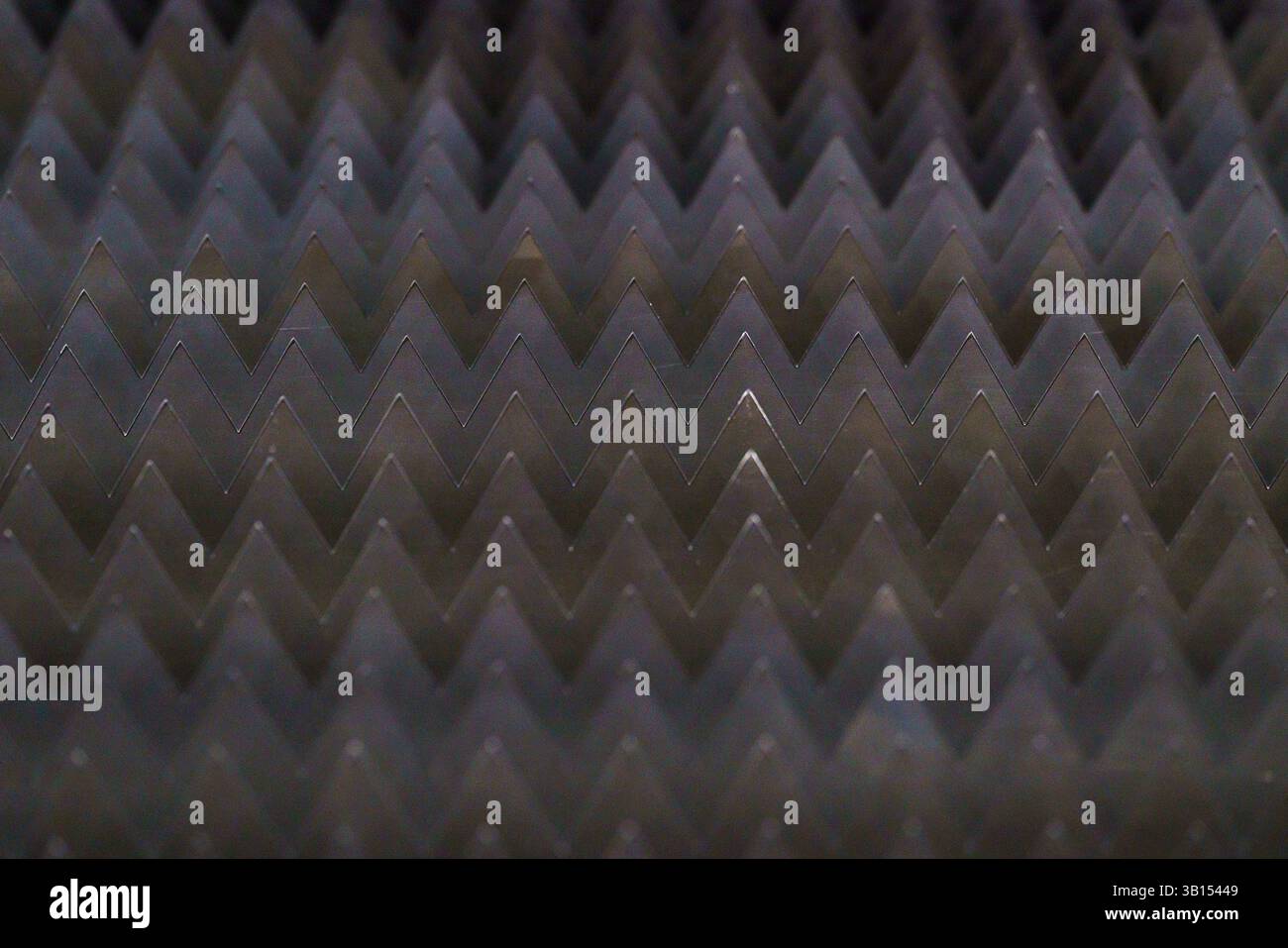a macro sharp metal teeth, total black background, closeup steel metal ...