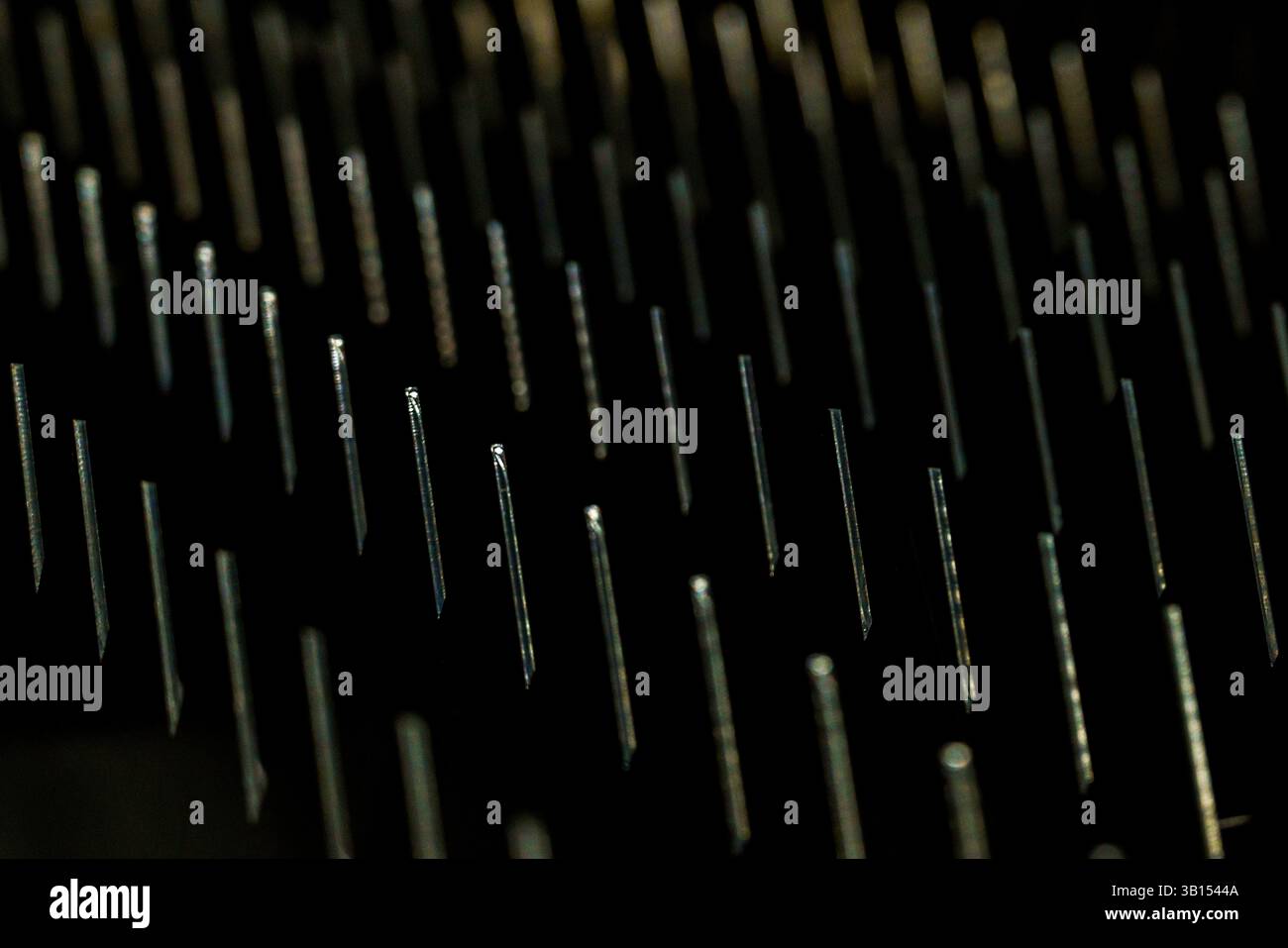 a macro sharp metal teeth, total black background, closeup steel metal ...