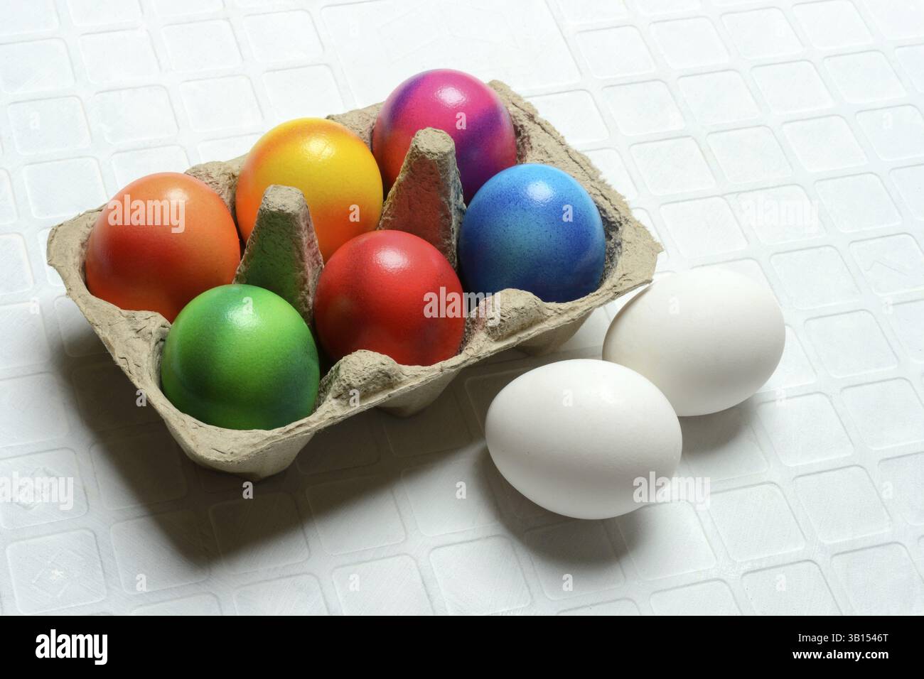 Colourful Easter eggs in packaging, Easter celebration Stock Photo - Alamy