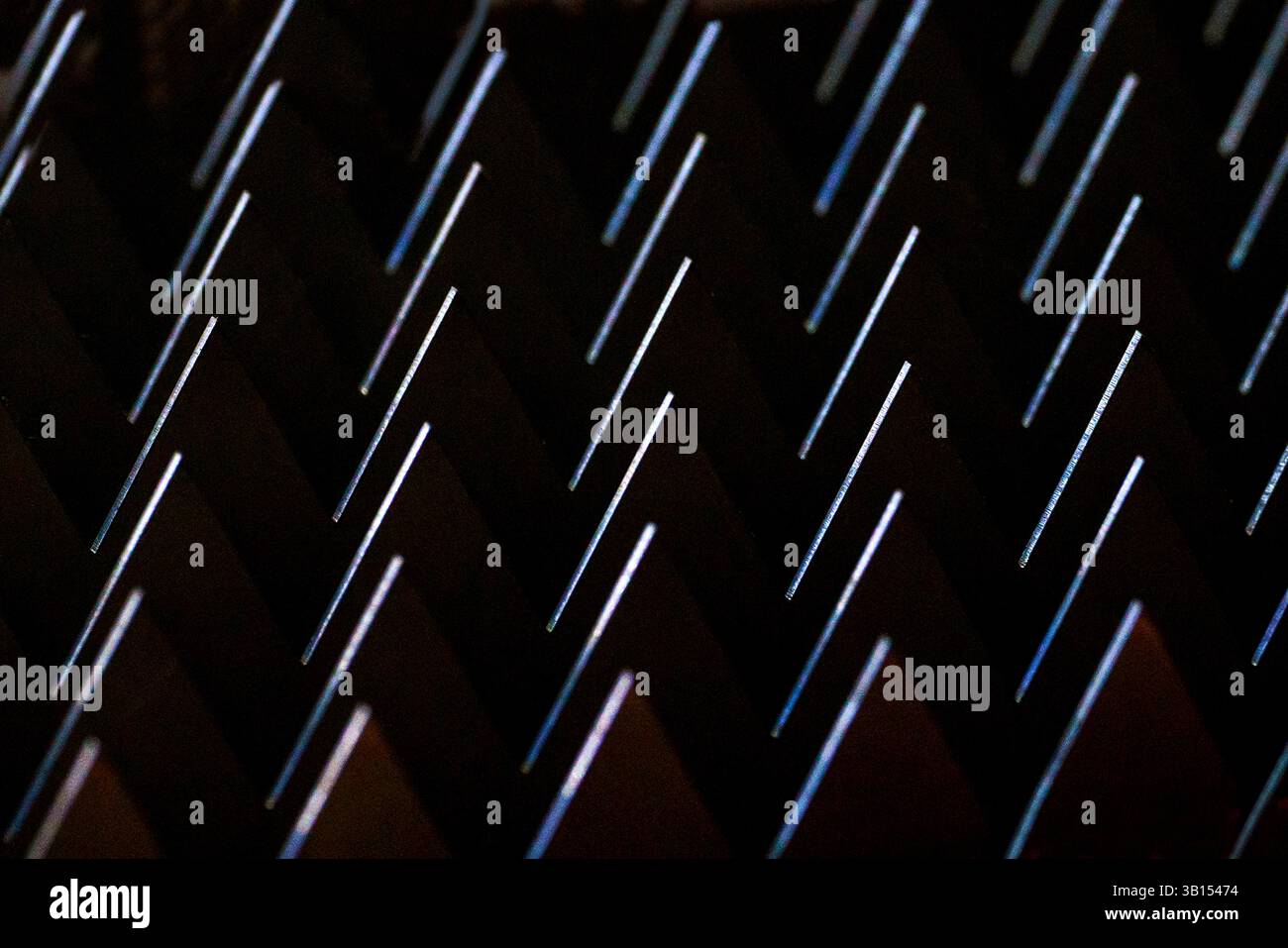 a macro sharp metal teeth, total black background, closeup steel metal ...