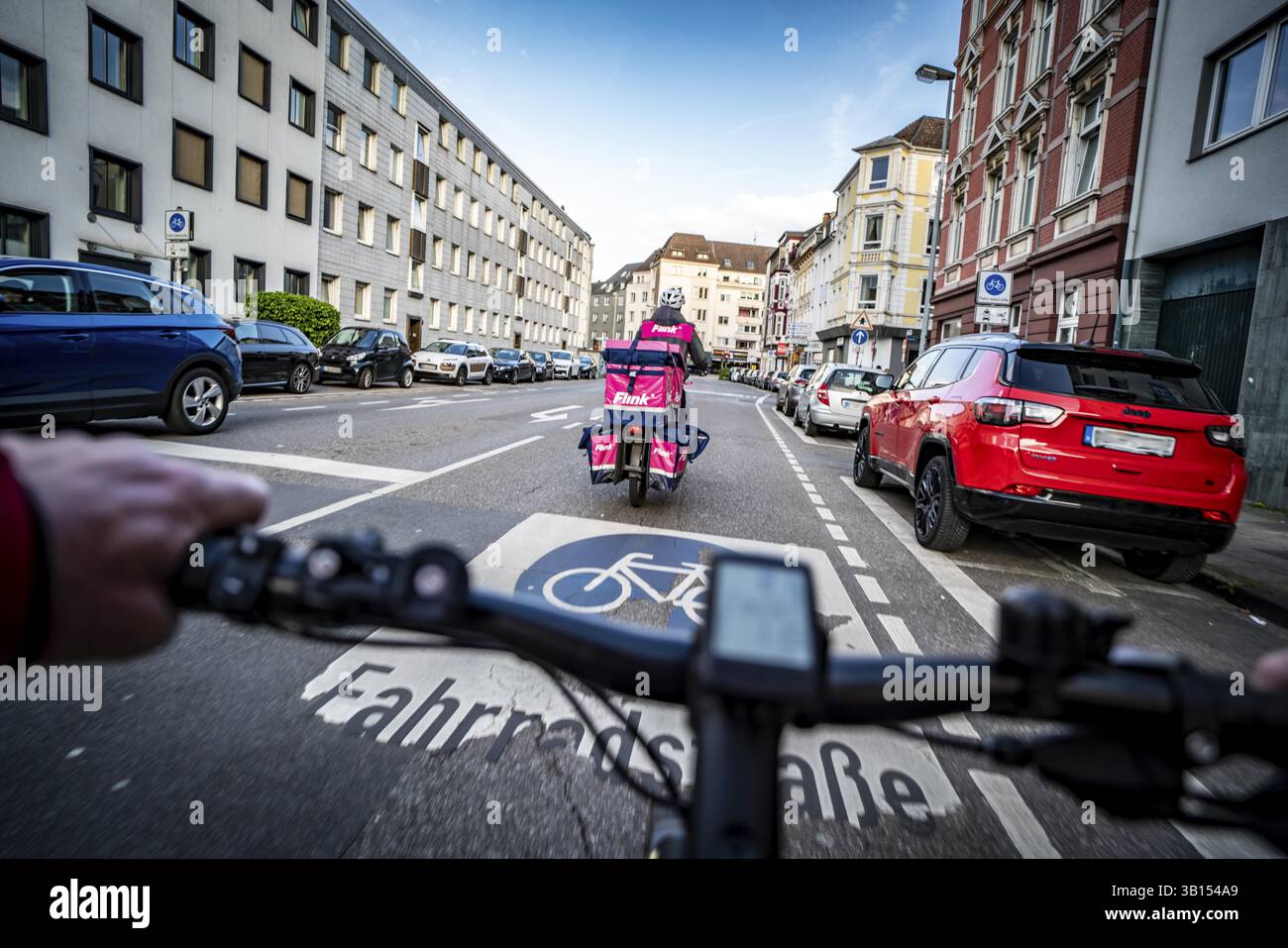 Cycling in the city, city centre road, cycle lane, two-wheeled traffic ...