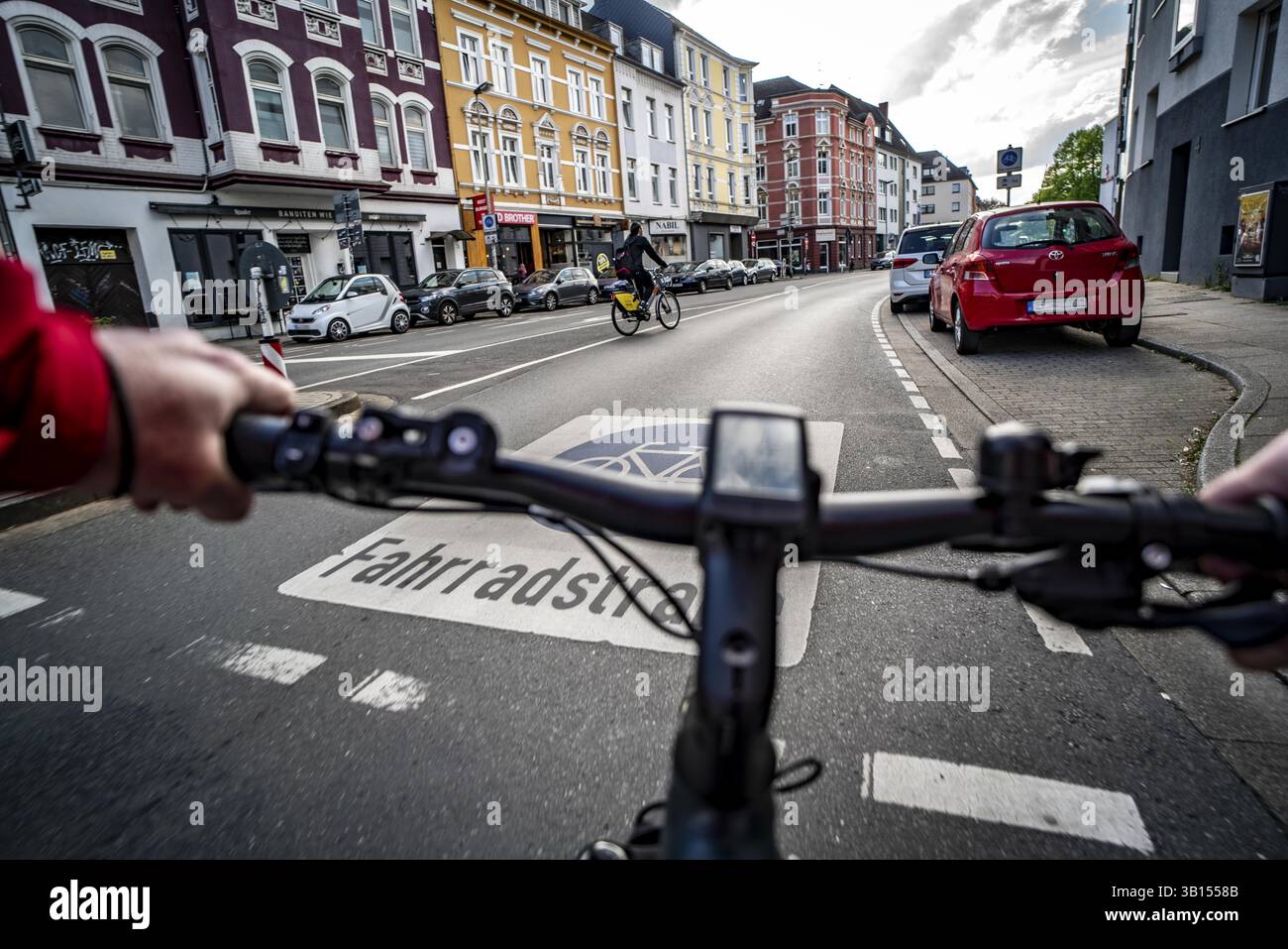 Cycling in the city, city centre road, cycle lane, two-wheeled traffic ...