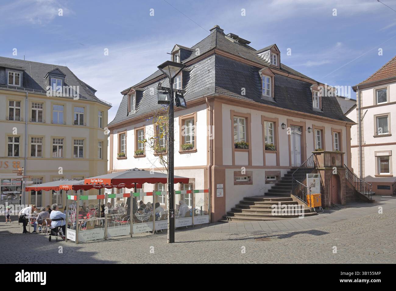Old town hall built in 1803 and street pub with people, Sankt Wendel ...
