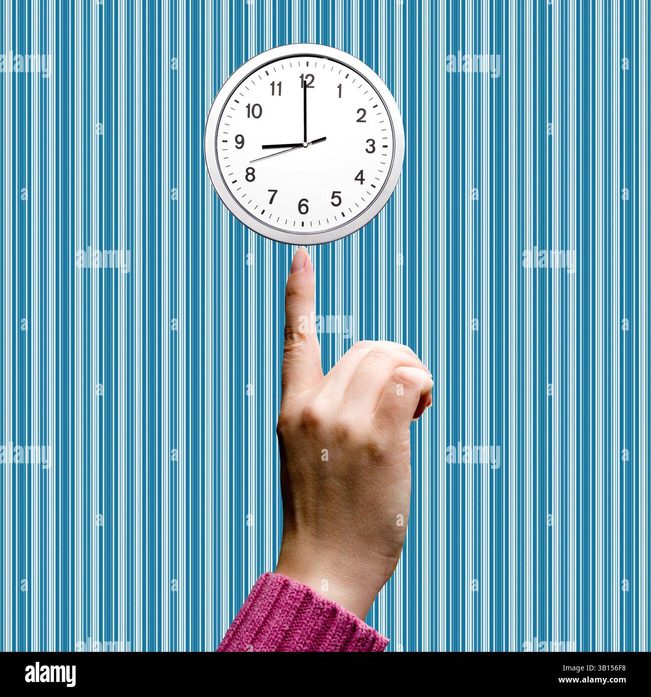woman hand with finger pointing to a clock at 9 o'clock hour Stock ...