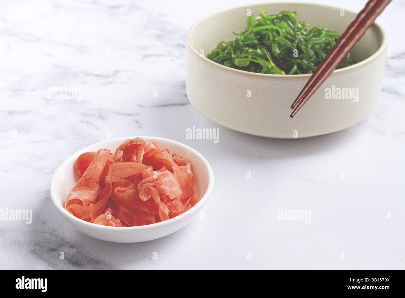 Chuka salad, made from fresh seaweed, with sesame dressing, in a white ...