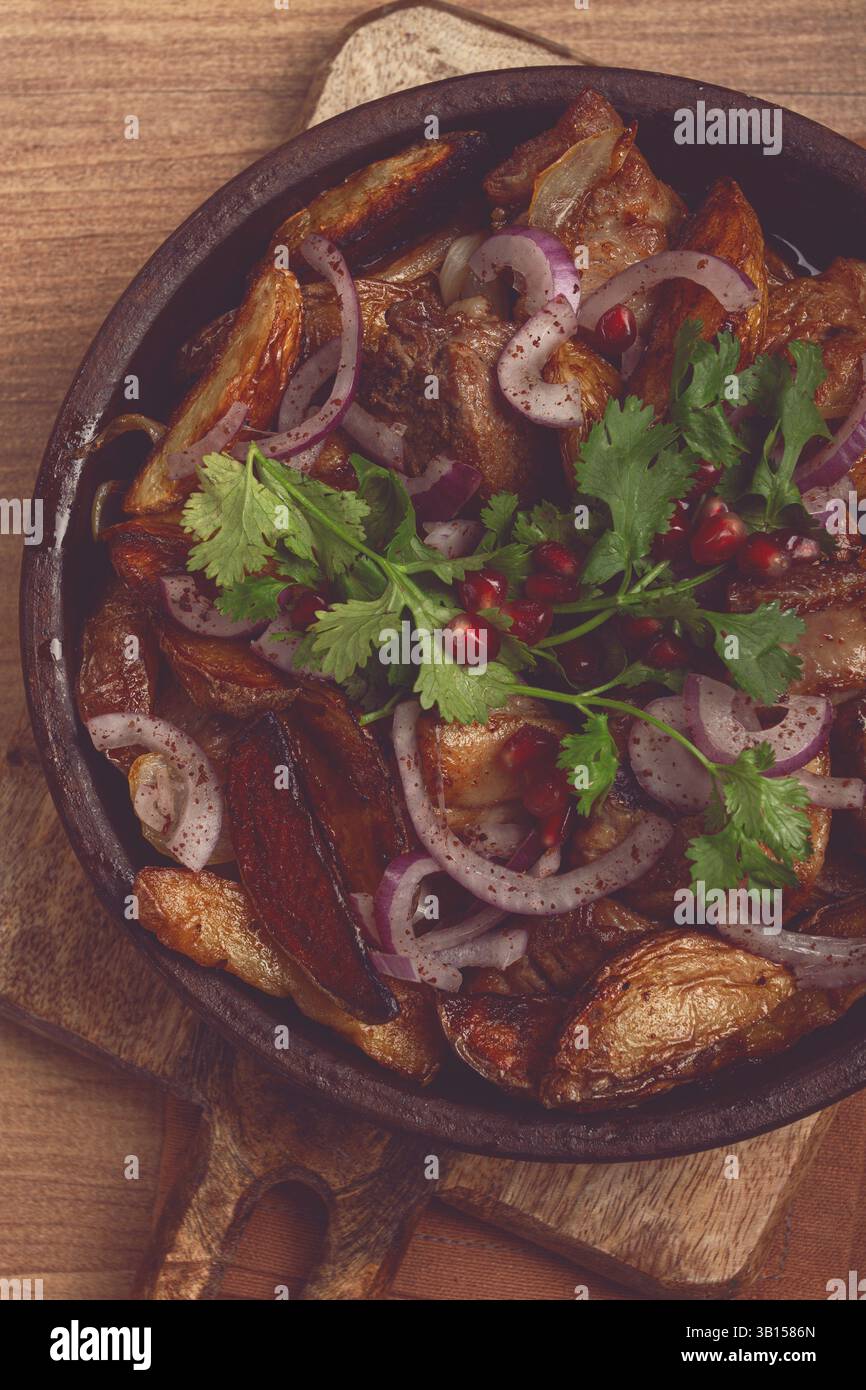 Ojakhuri, a traditional Georgian dish, fried potatoes with meat, in a ...