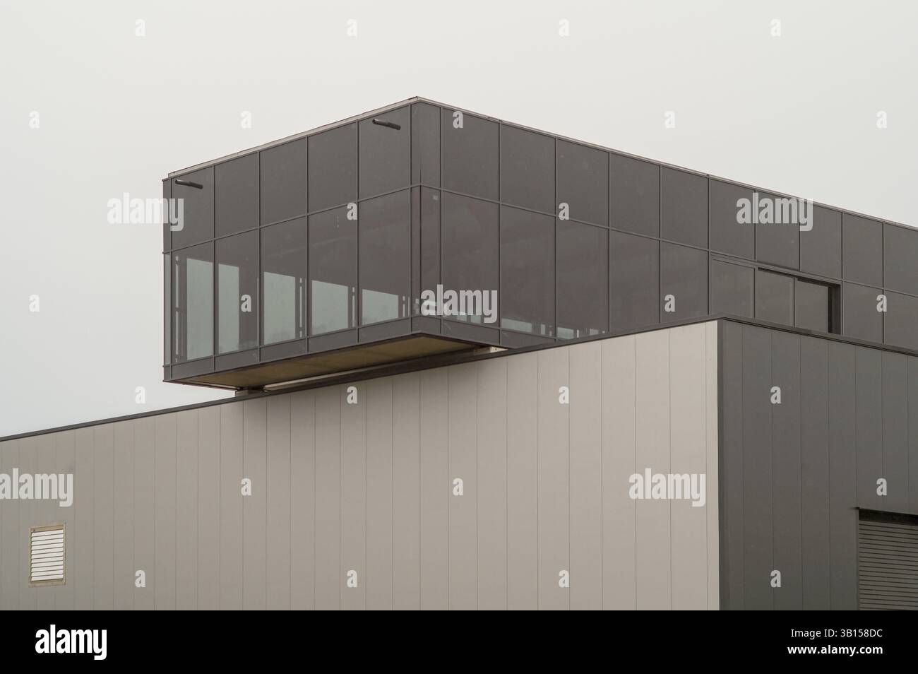 Borken, NRW, Germany, Modern glass office building cantilevered over ...