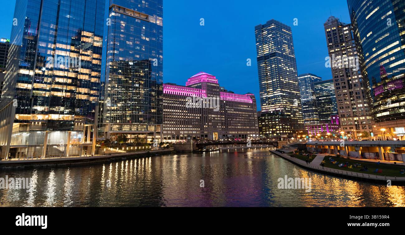 Chicago architecture of skyscraper at river. City night illuminated ...