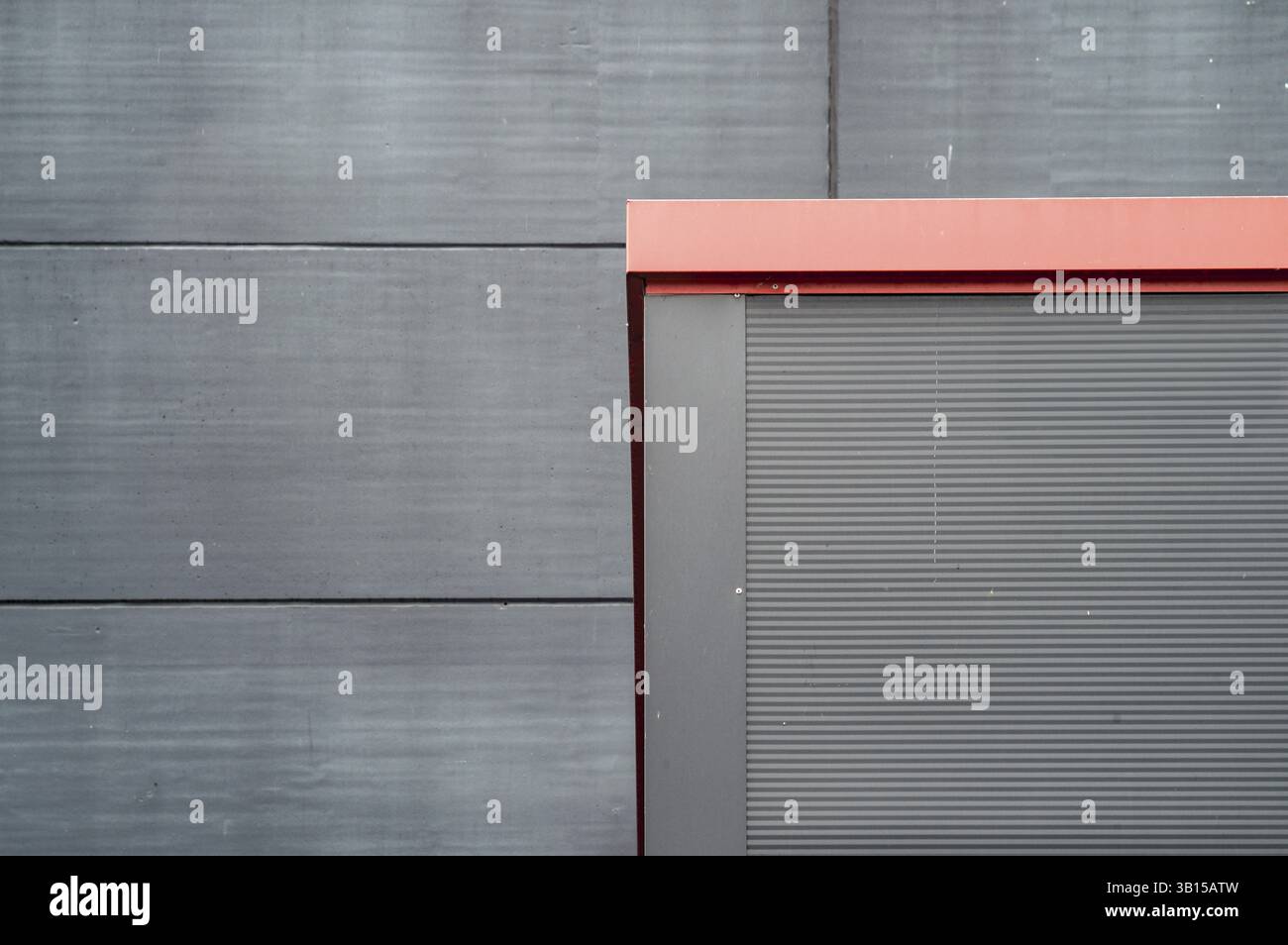 Borken, NRW, Germany, Gray concrete wall meets corrugated metal siding ...
