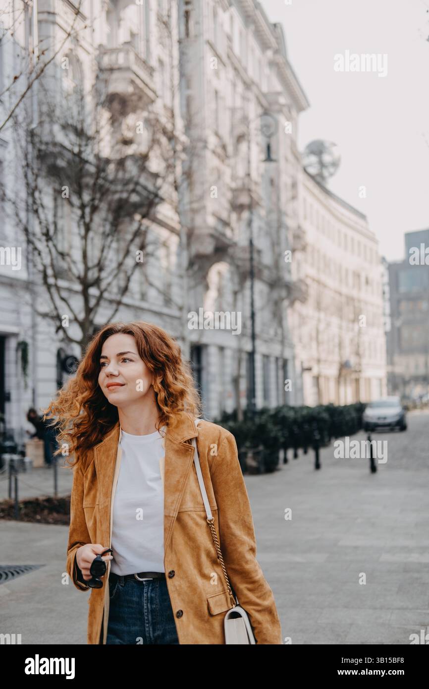 Young traveler embracing slow urban exploration on a peaceful city ...