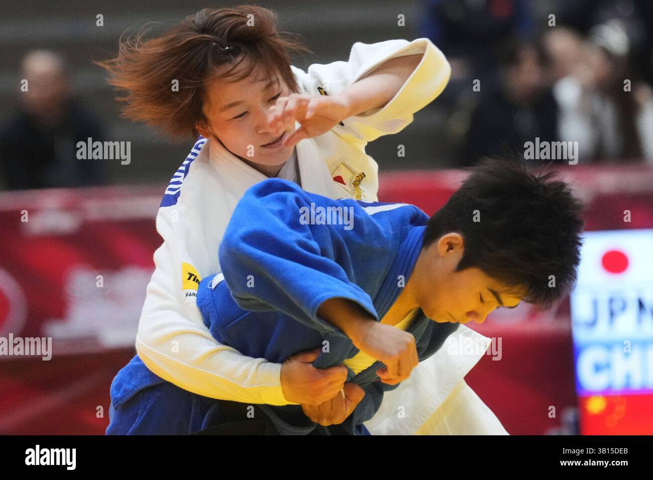 Japan's Kokoro Fujishiro, white, and China's Yuanli Zhang compete ...