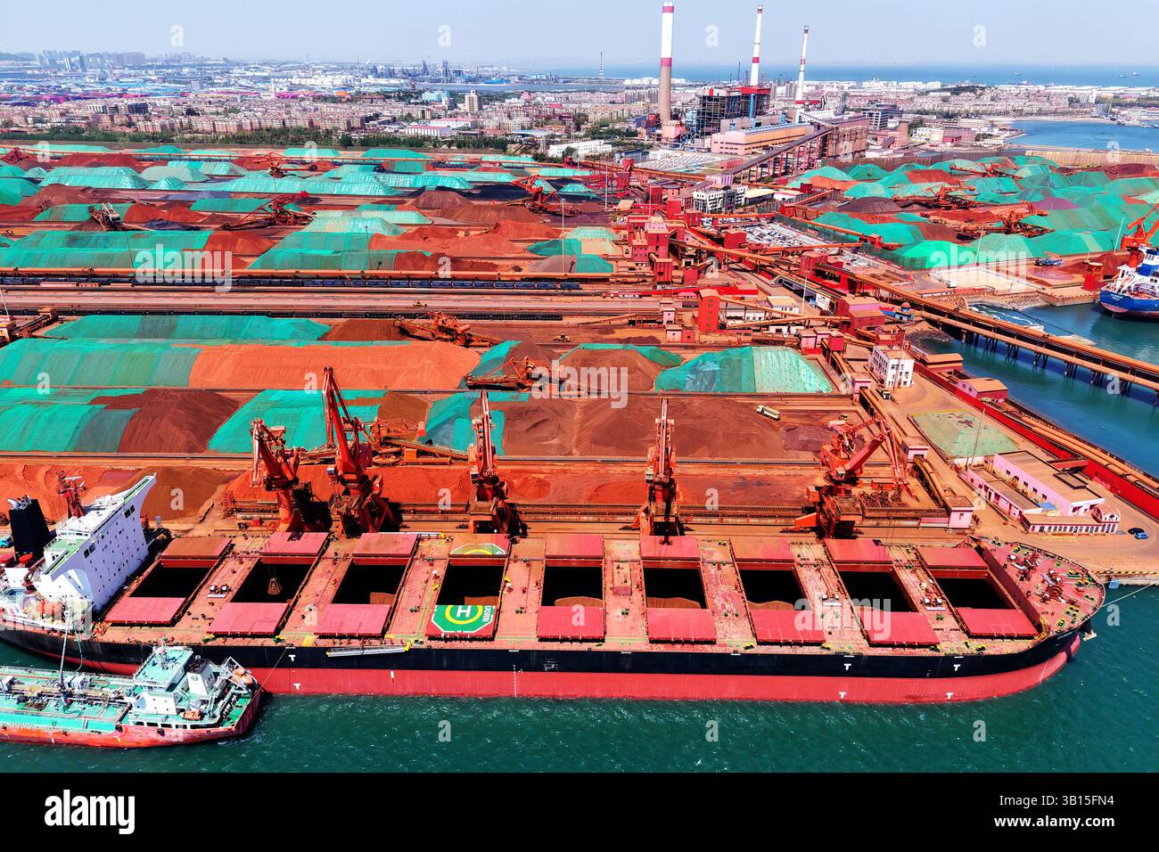 QINGDAO, CHINA - APRIL 25, 2025 - A cargo ship unloaded imported iron ...