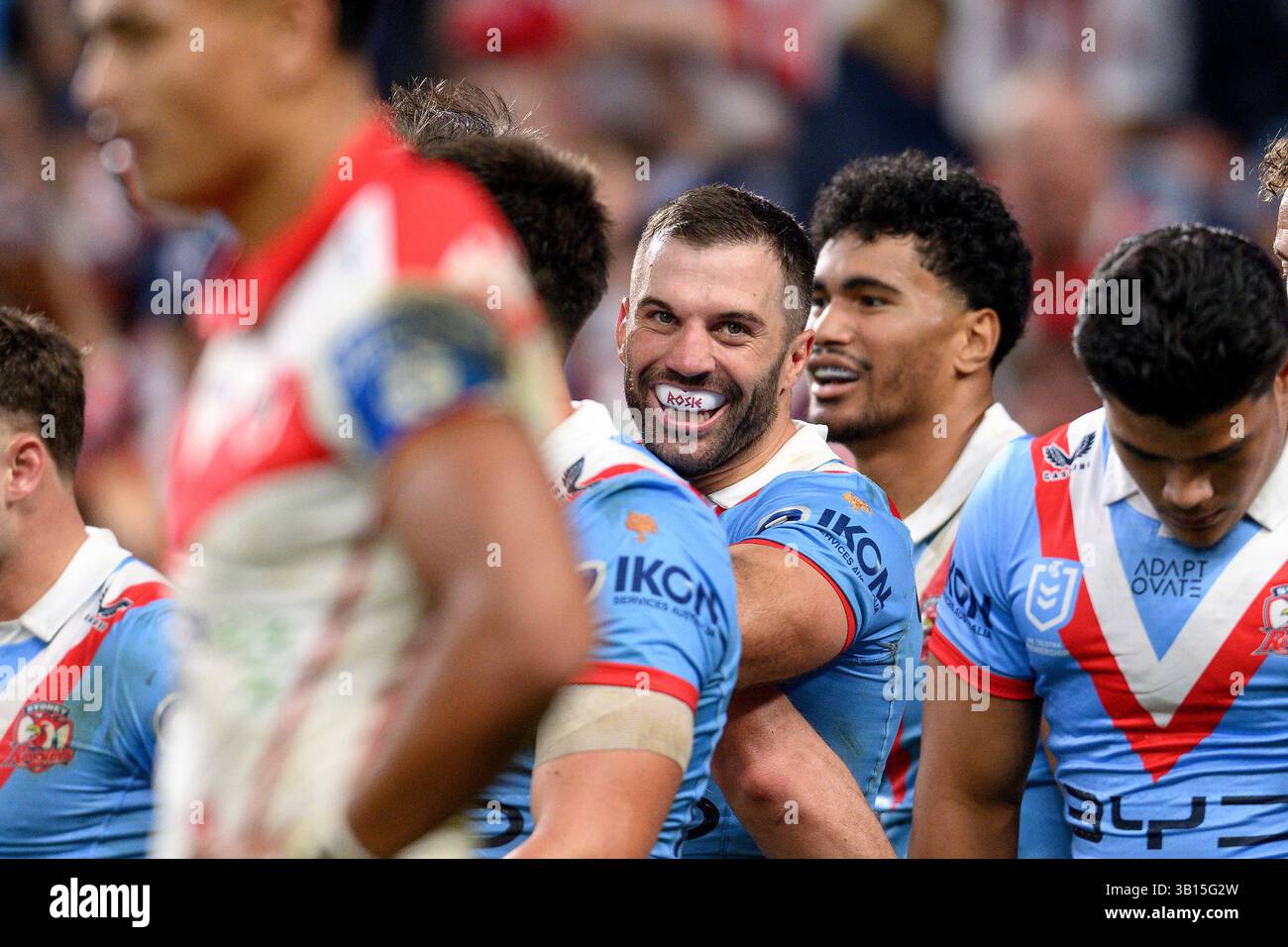 Sandon Smith of the Roosters tackles Lachlan Ilias of the Dragons ...