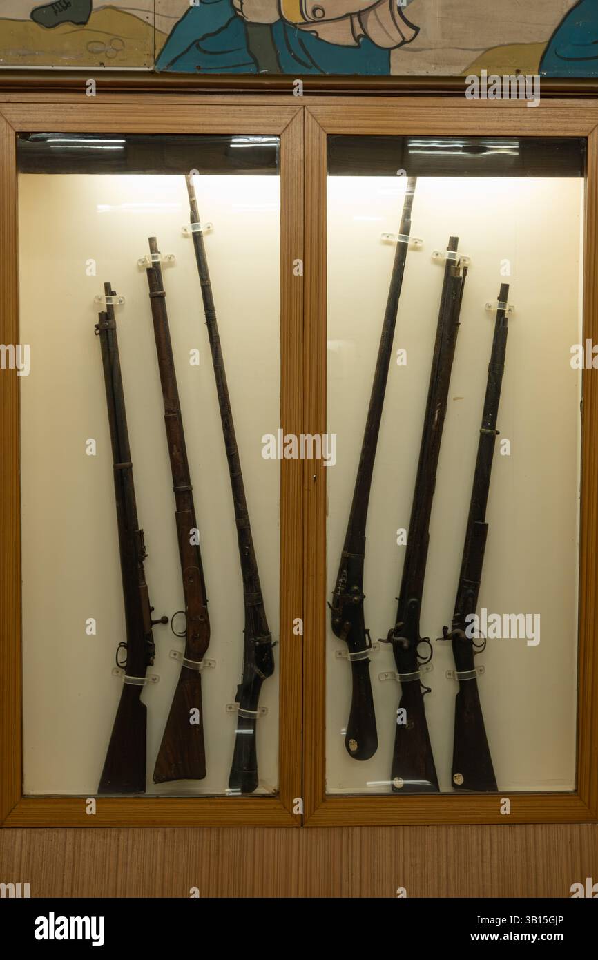 A few rifles that show a variety of guns such as flintlock; musket ...