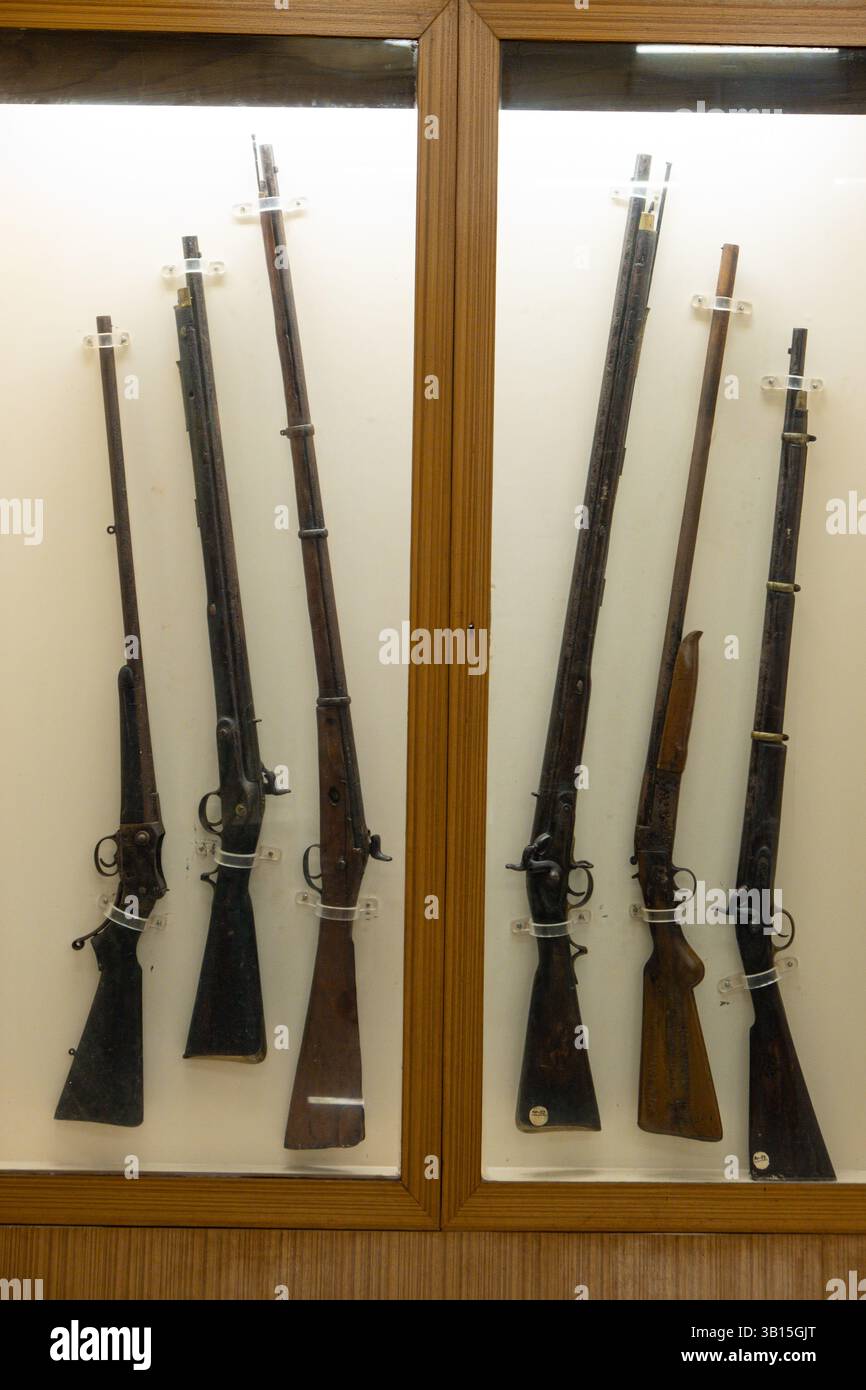A few rifles that show a variety of guns such as flintlock; musket ...