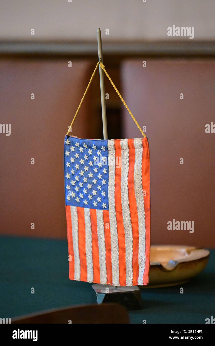 PRODUCTION - 24 April 2025, Berlin: A replica of a small flag of the ...