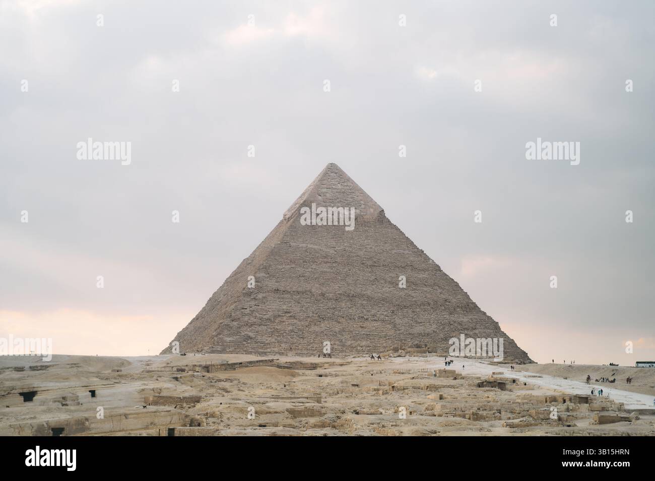 The Majestic Pyramids of Giza Stand Tall Against a Dramatic, Cloudy Sky ...