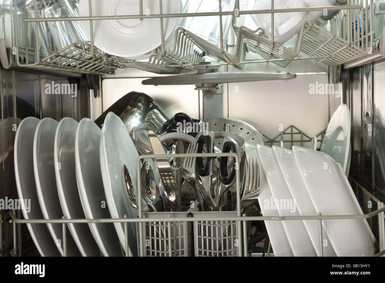 Detail of the two inner shelves of a metal-rack dishwasher with ...