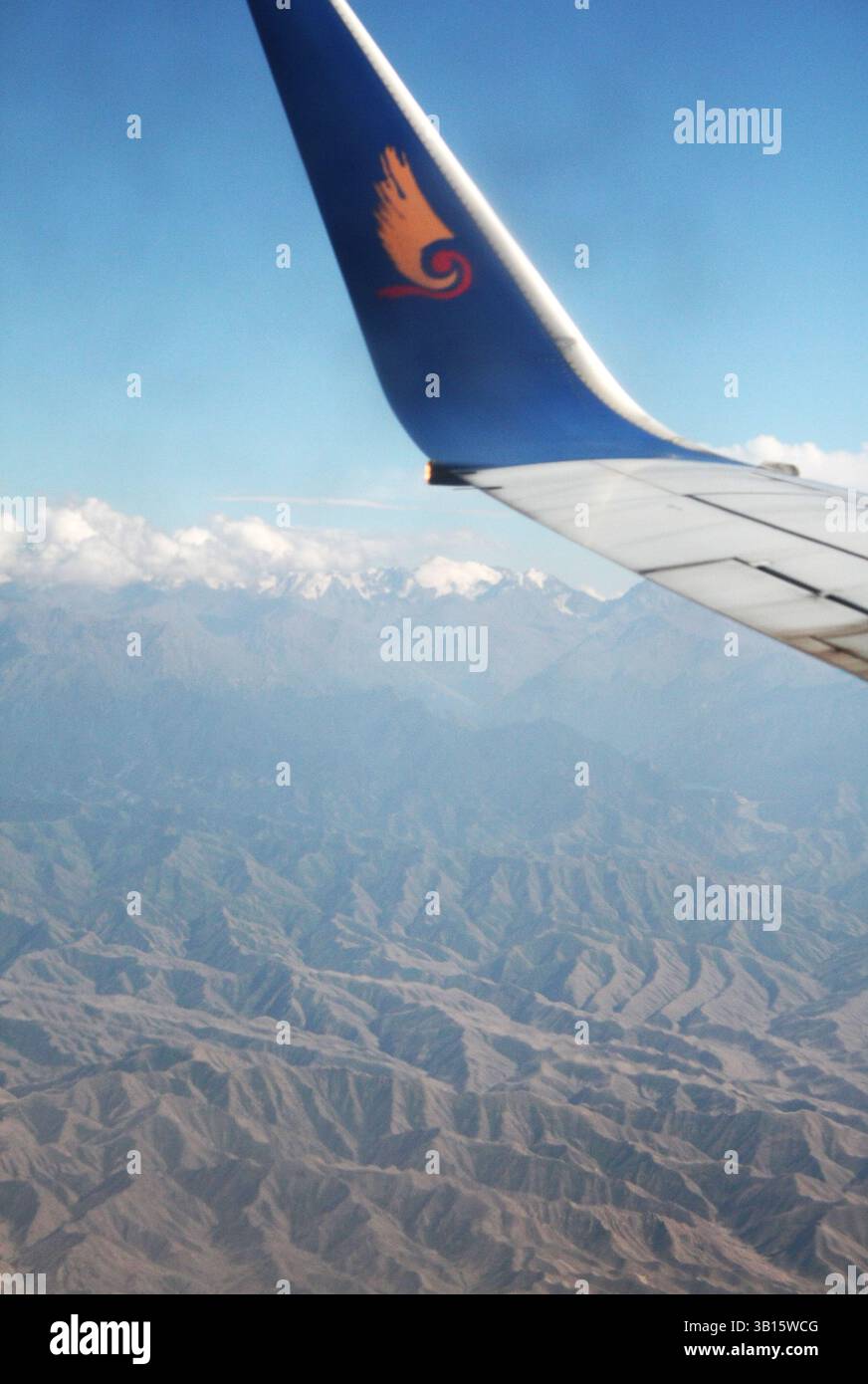 Wingtip of Hainan Airlines Boeing 737 with Mountain Landscape from High ...