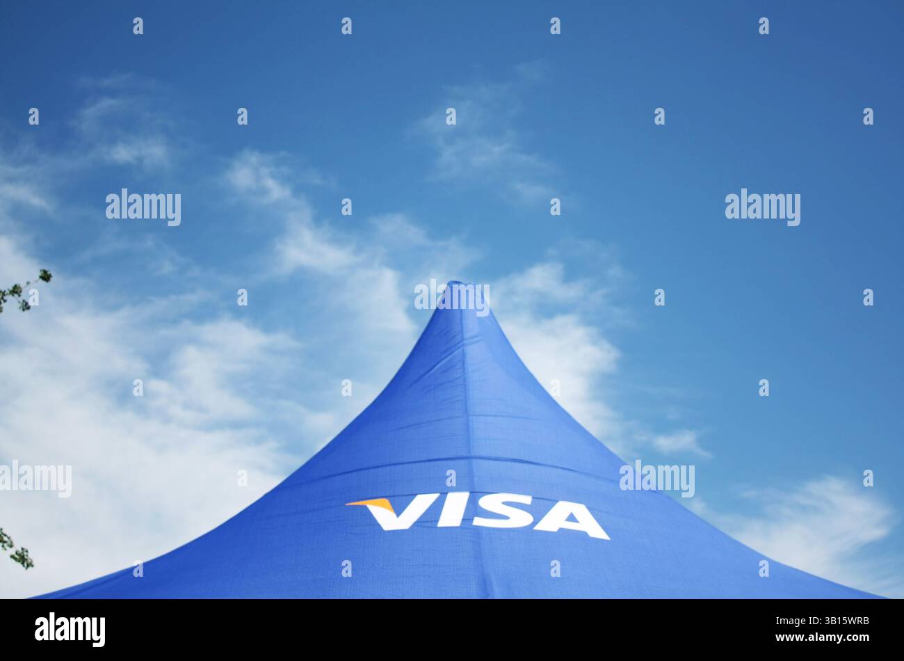 VISA branding on a blue tent under the clear sky Stock Photo - Alamy