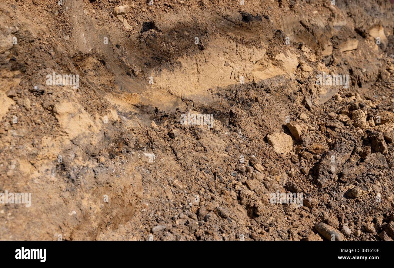 a part of the excavated pits during construction work on the road, the ...