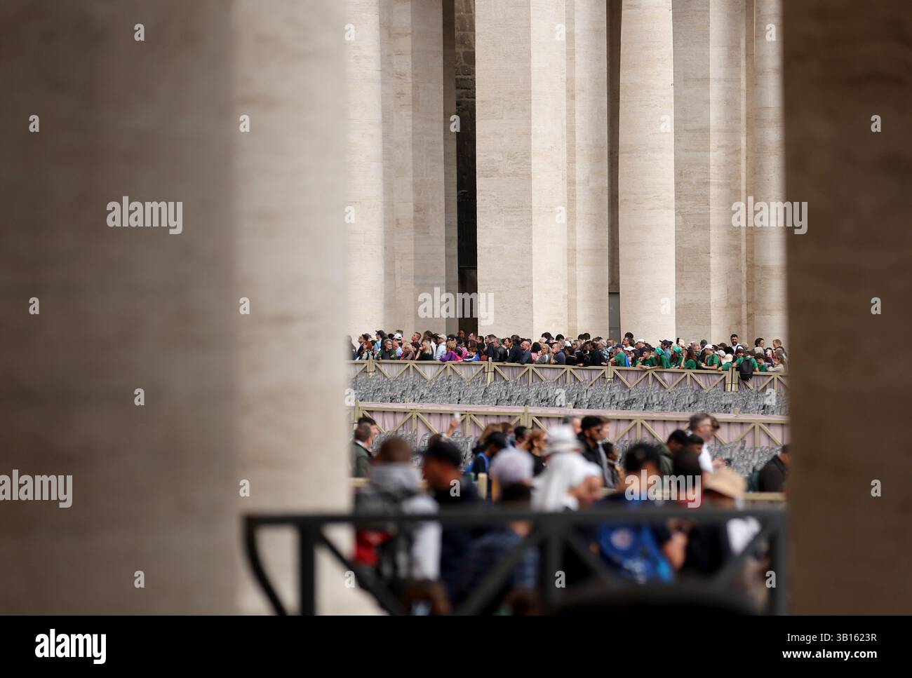Numerous believers formed a line in St. Peter's Square to pay their ...